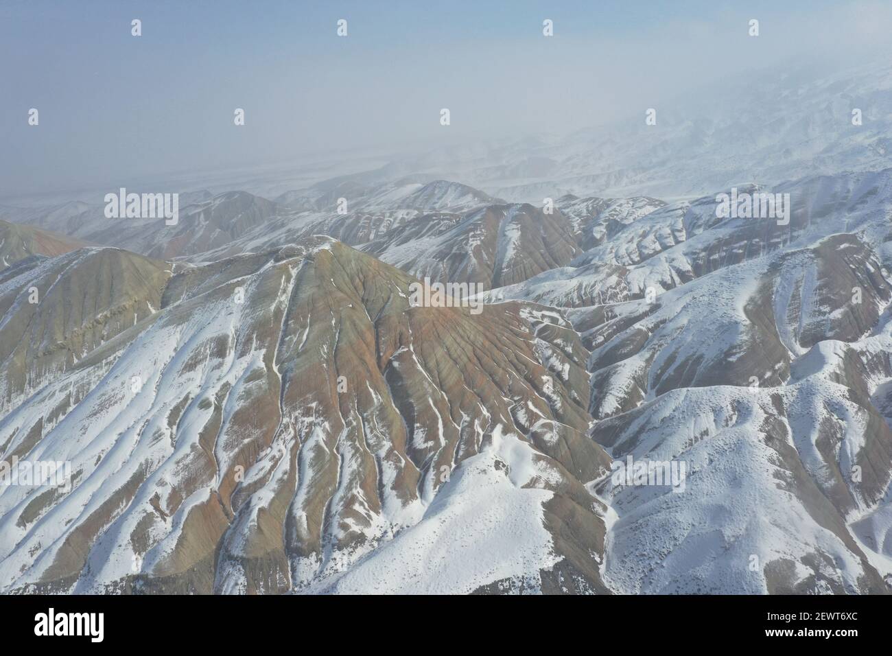 Aerial photos of colorful Hongshanzui on which the snow has not melted ...