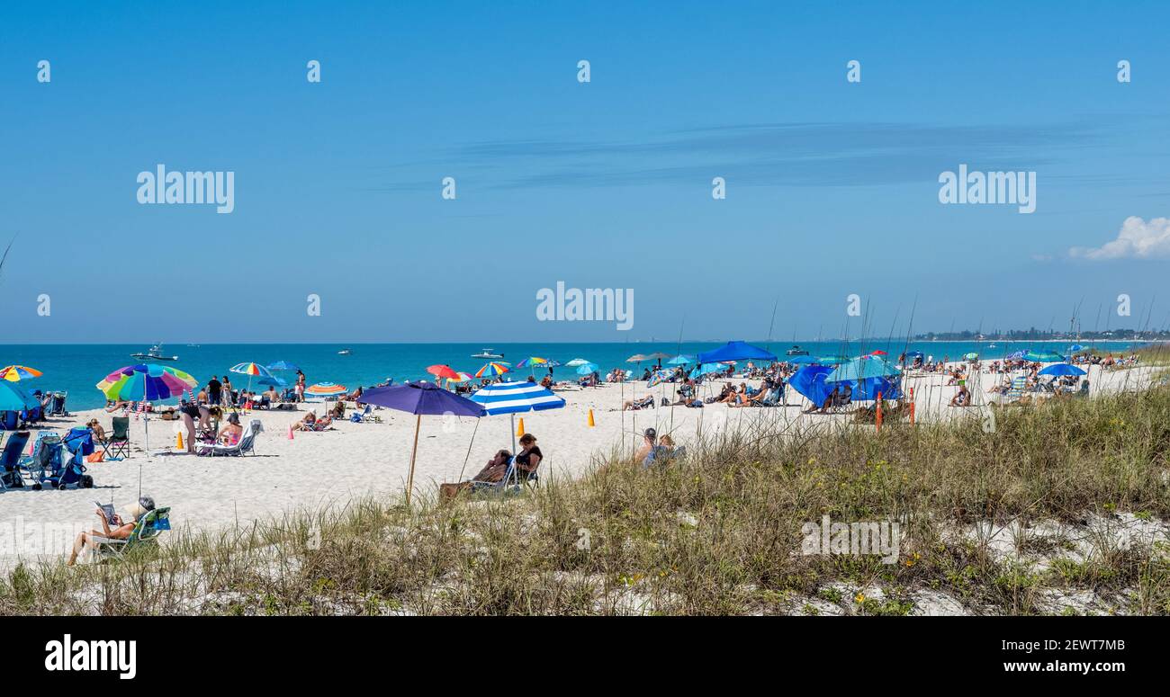 North Jetty Beach on the Gulf of Mexico during high tourist season in ...