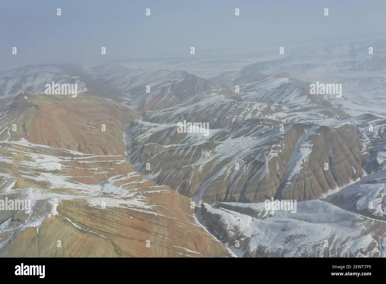 Aerial photos of colorful Hongshanzui on which the snow has not melted ...