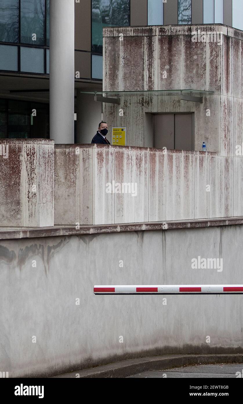 A security guard at the rear entrance to the Criminal Courts of Justice ...