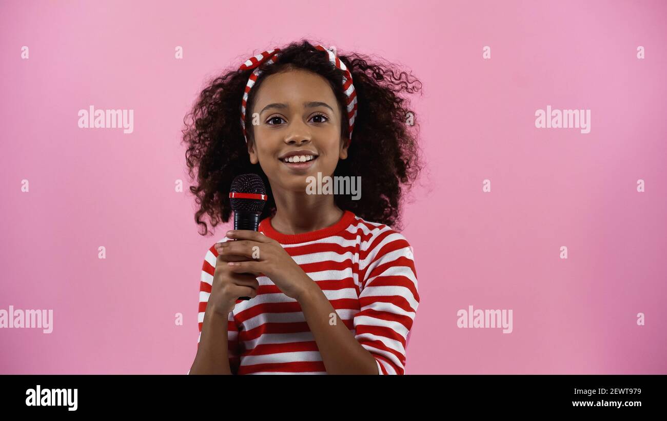 Girl holding microphone hi-res stock photography and images - Alamy