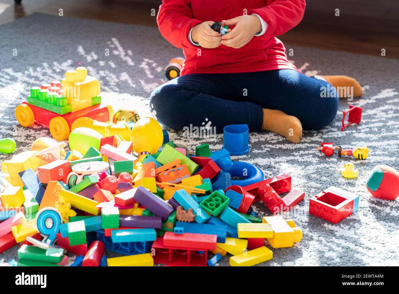 a child playing with toys Stock Photo - Alamy