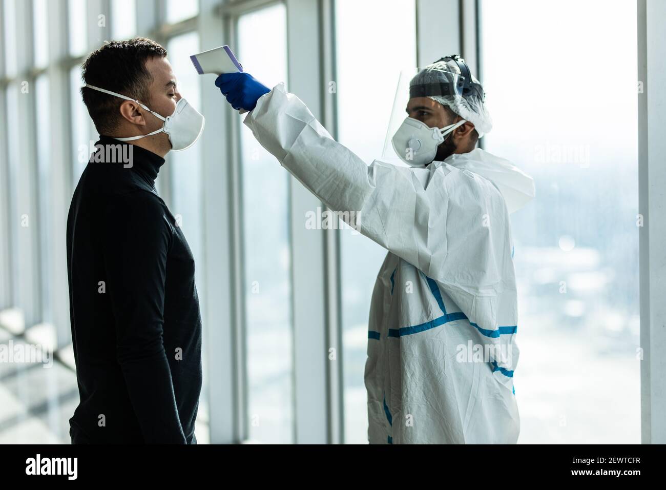 Medical Physician in Safety Gear Measuring Male Patient's Body ...
