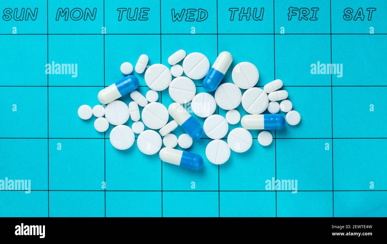Pill schedule, various pills and capsules on a weekly calendar Stock ...