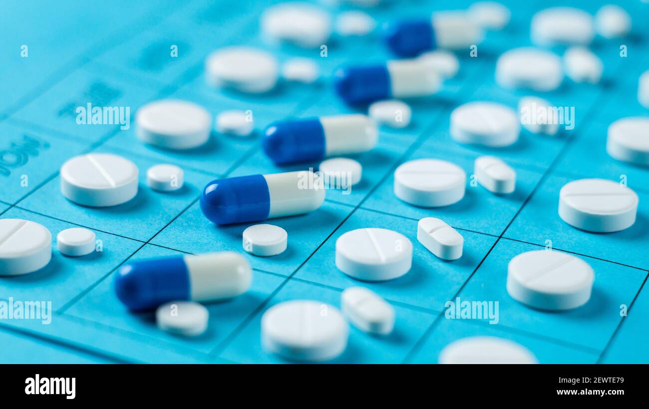 Pill schedule, various pills and capsules on a weekly calendar Stock ...