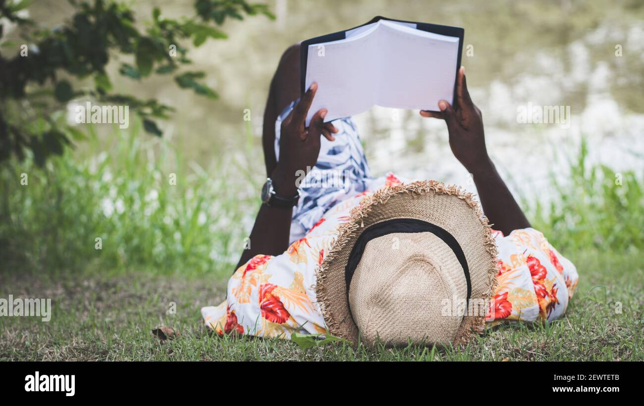 African american man reading tree hi-res stock photography and images ...