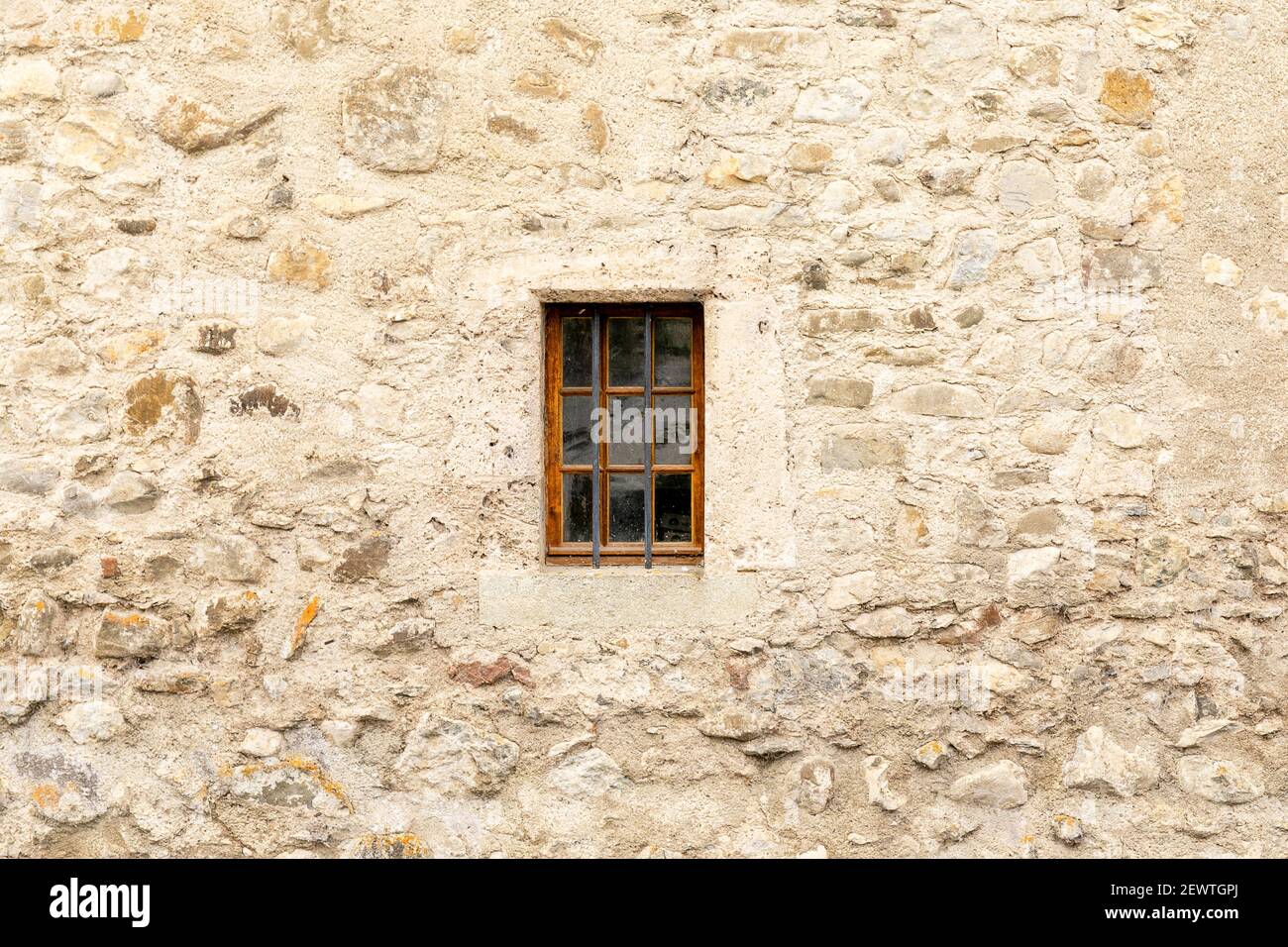 Minimalist photo of a castle window encased within a stone wall Stock ...