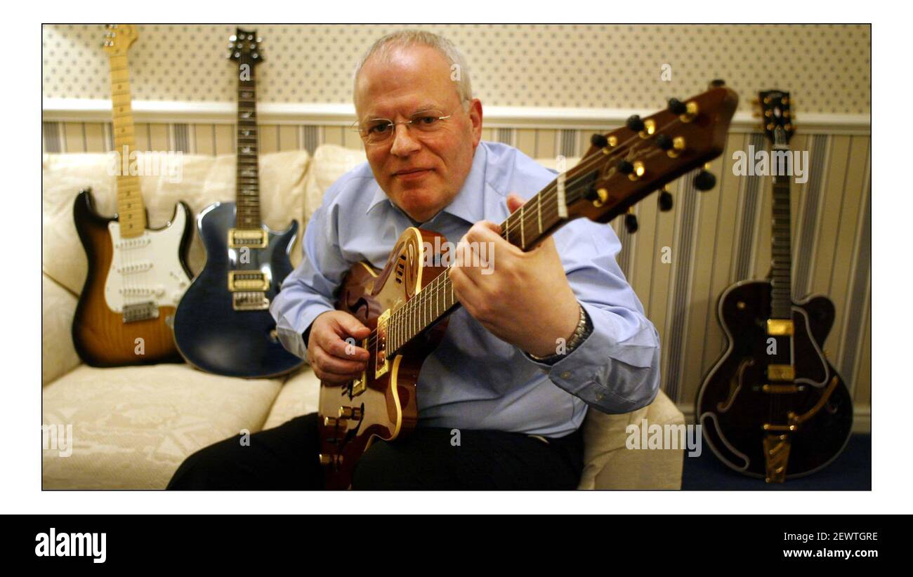 Peter Bridger with a few of his guitars.pic David Sandison 1/2/2005 ...