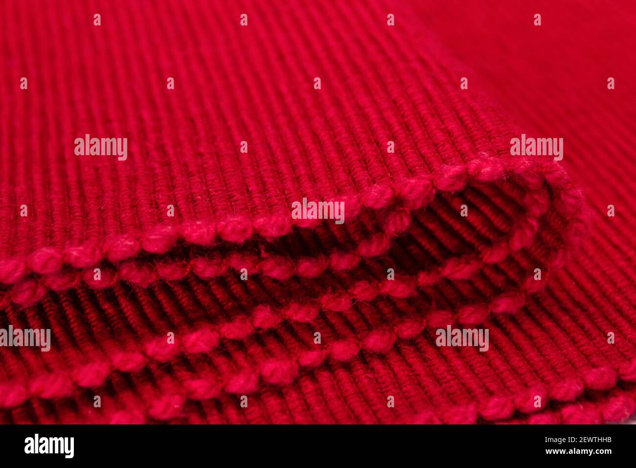 Bright red textured fabric. Red textile background. Ribbed folded ...