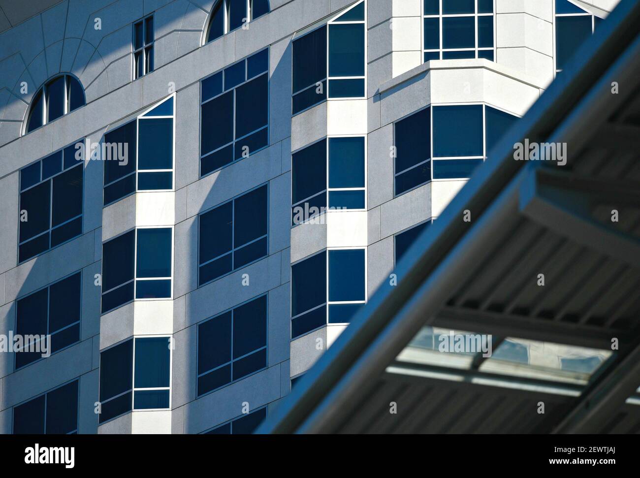 Corporate offices high-rise building facade with symmetrical windows ...