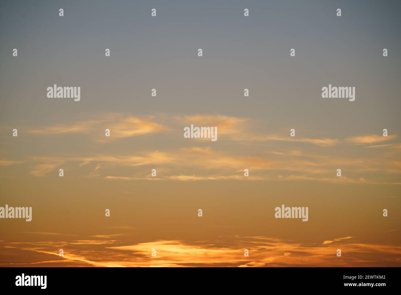 Dramatic sunset sky with orange colored clouds Stock Photo - Alamy