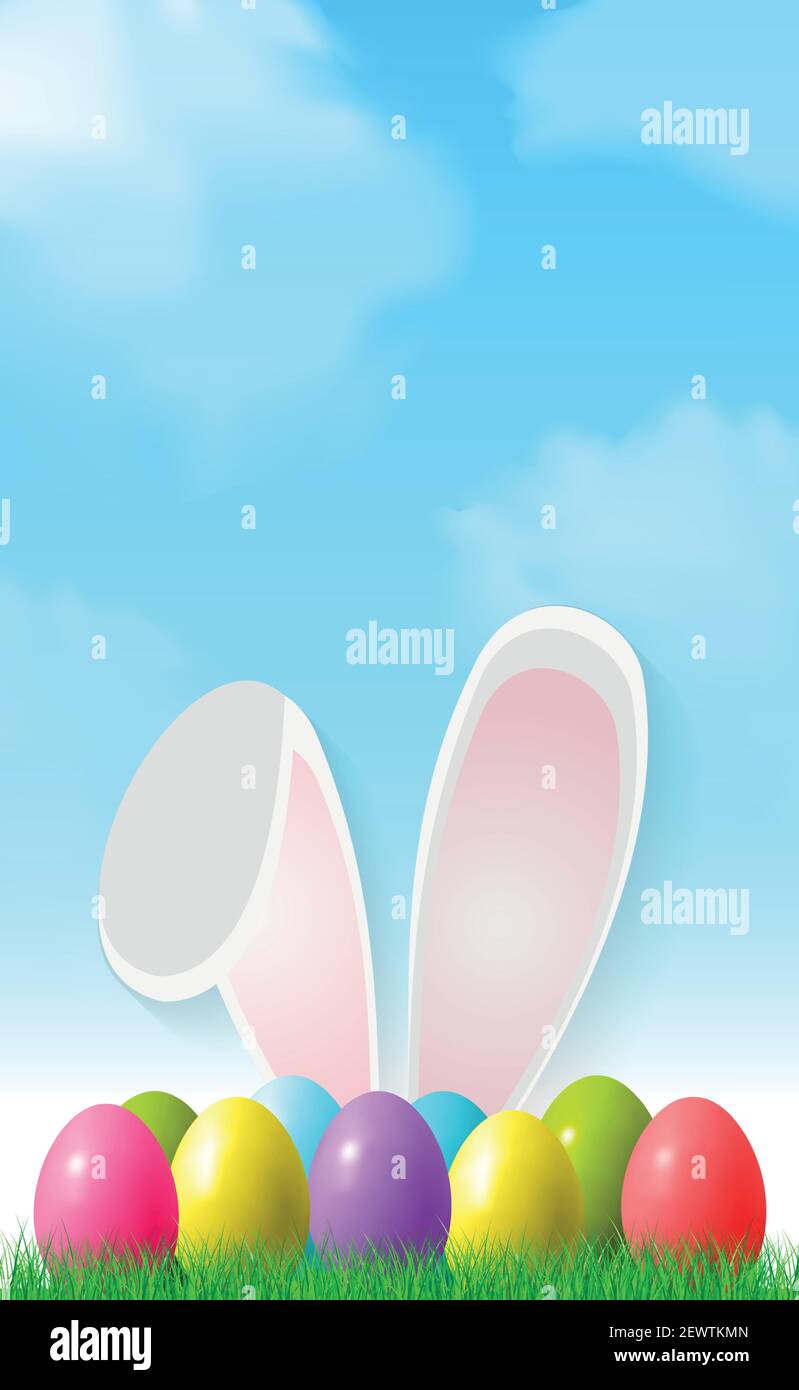 Easter background with colorful eggs lying on the grass, bunny ears ...