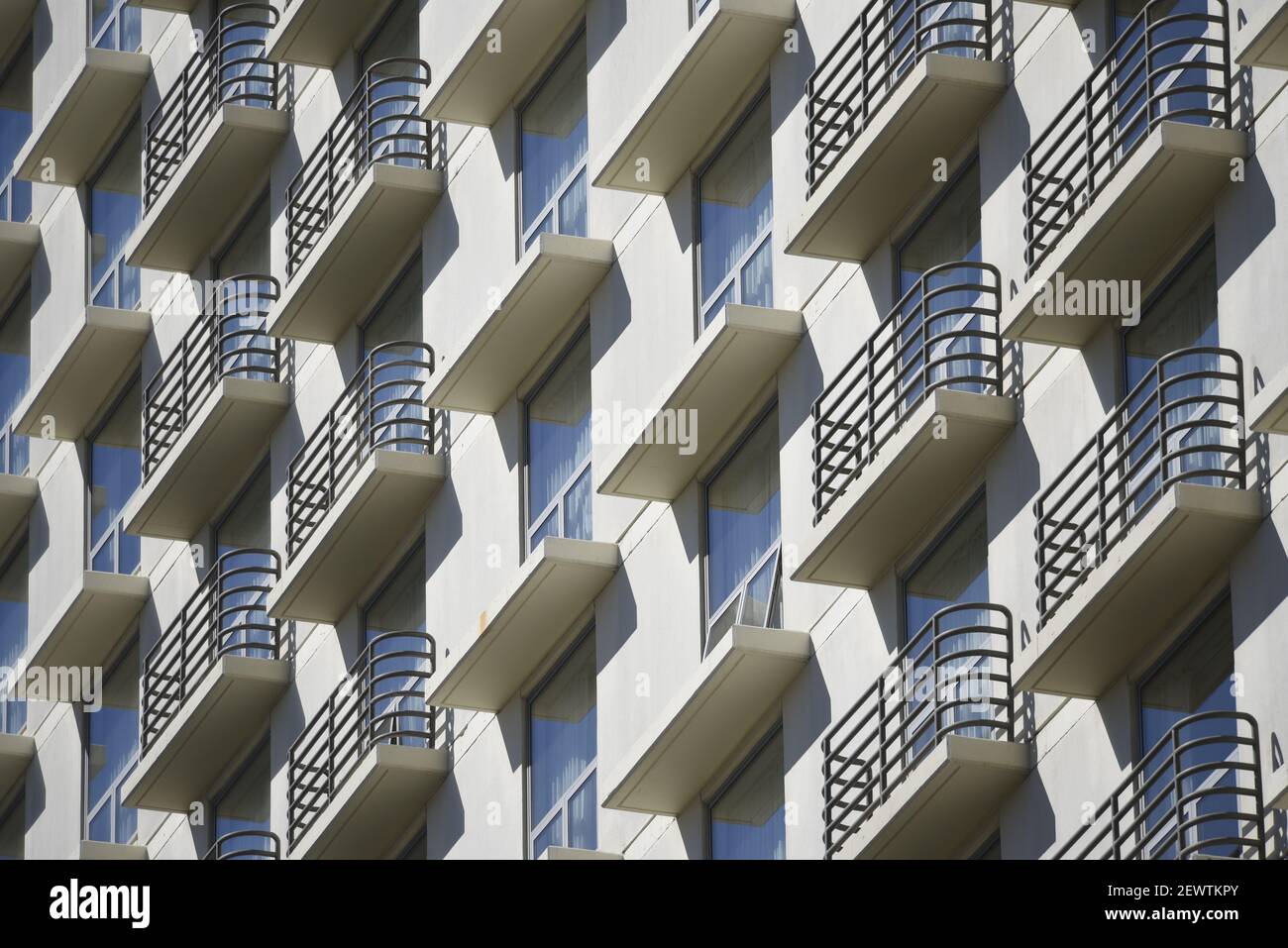 Luxury hotel high-rise building white concrete facade with symmetrical ...