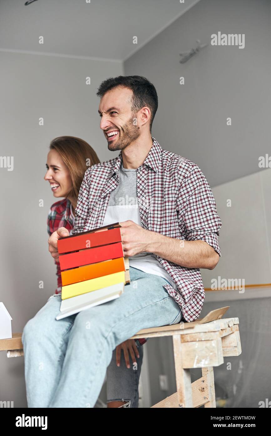 Two joyful colleagues laughing in the workplace Stock Photo - Alamy