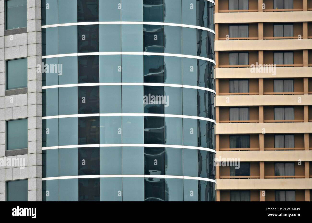 Luxury high-rise hotel facade with symmetrical glass windows and ...