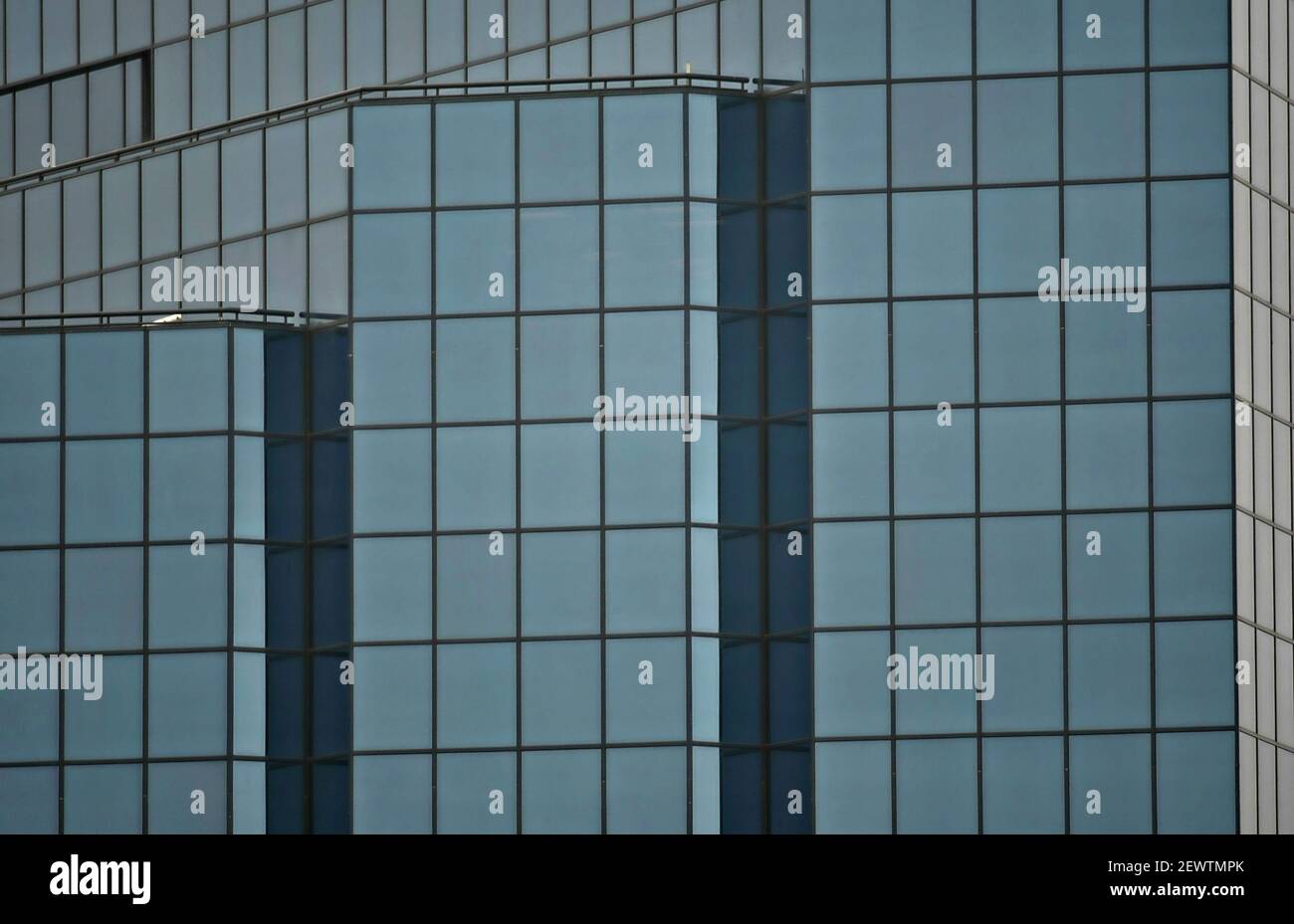 Corporate offices high-rise building grey glass facade with steel ...