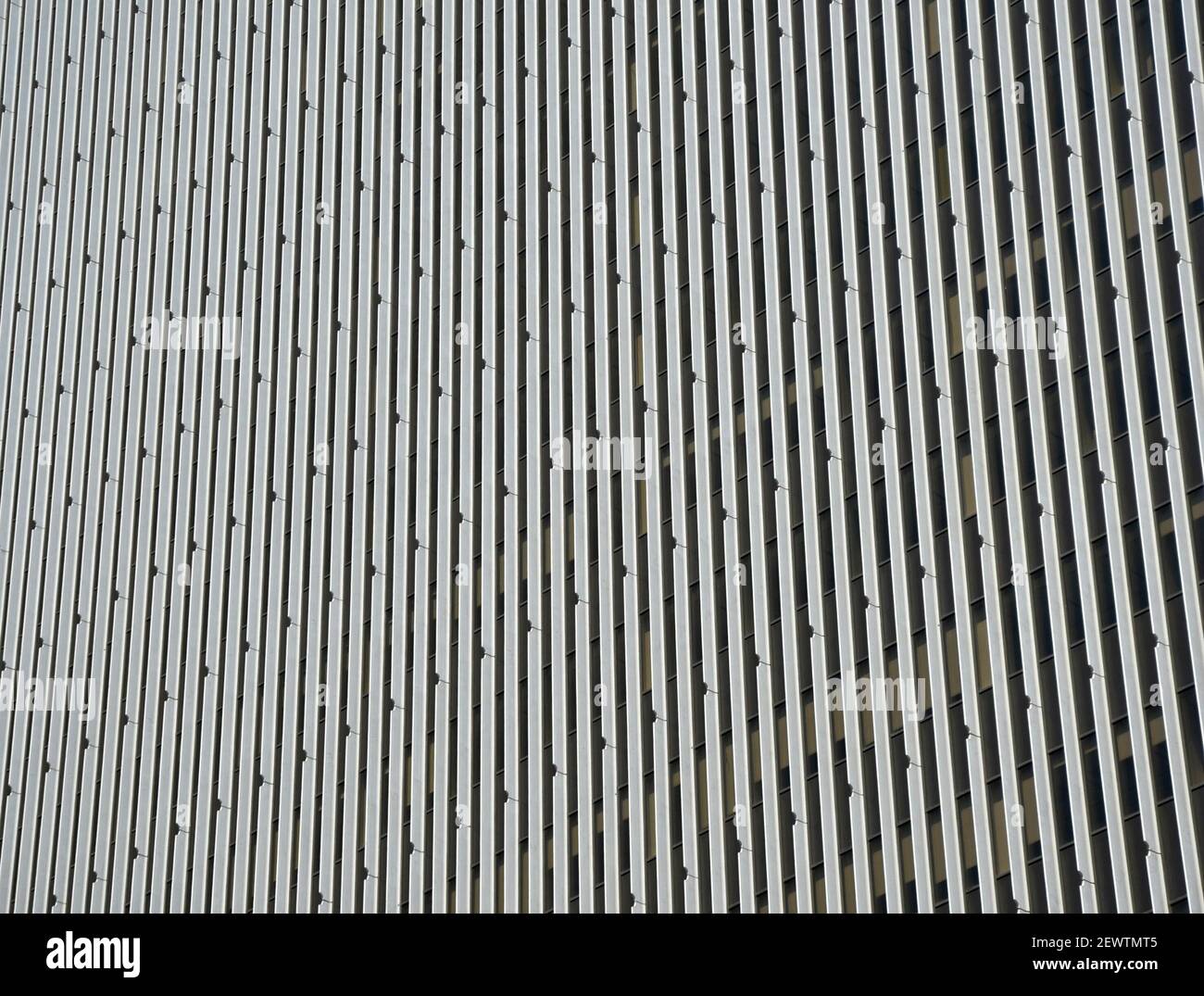 Commercial high-rise building facade covered with symmetrical white ...