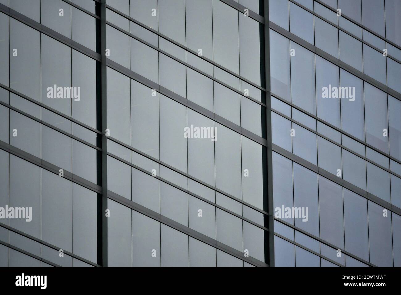 Corporate offices high-rise building grey glass windows facade in San ...