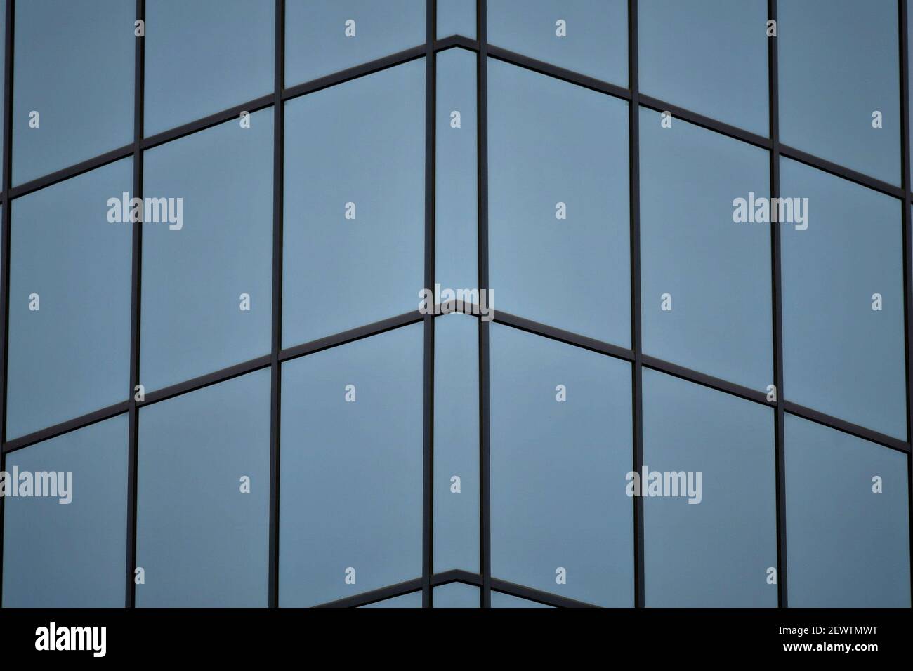 Corporate offices high-rise building grey glass windows facade in San ...