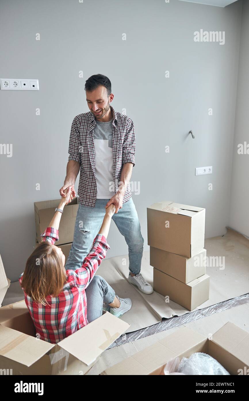 Helping stand up hi-res stock photography and images - Alamy