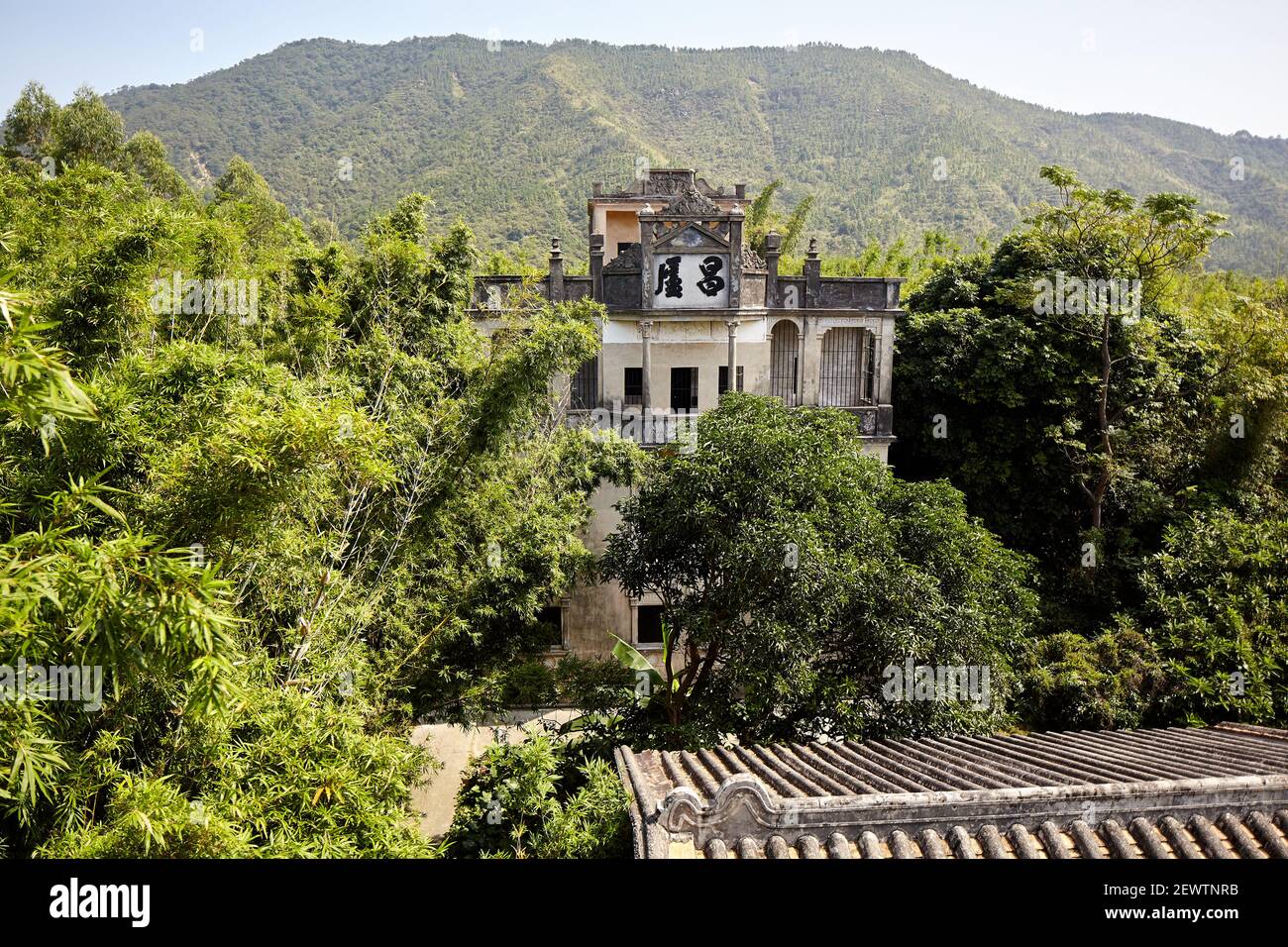 Changlu mansion is surrounded by bamboo and other greenery in ...