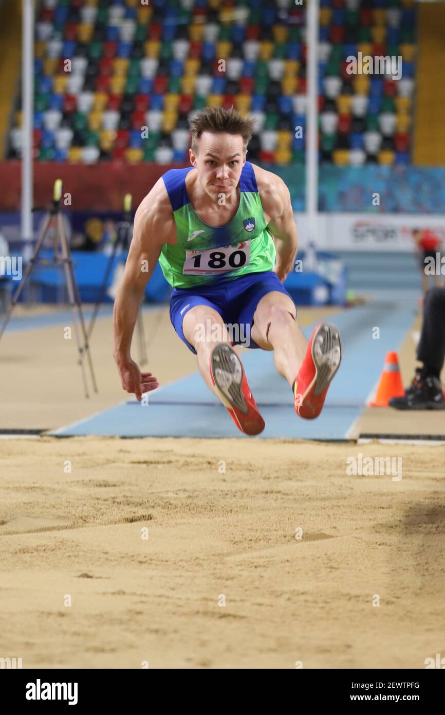 ISTANBUL, TURKEY - FEBRUARY 20, 2021: Undefined athlete long jumping ...