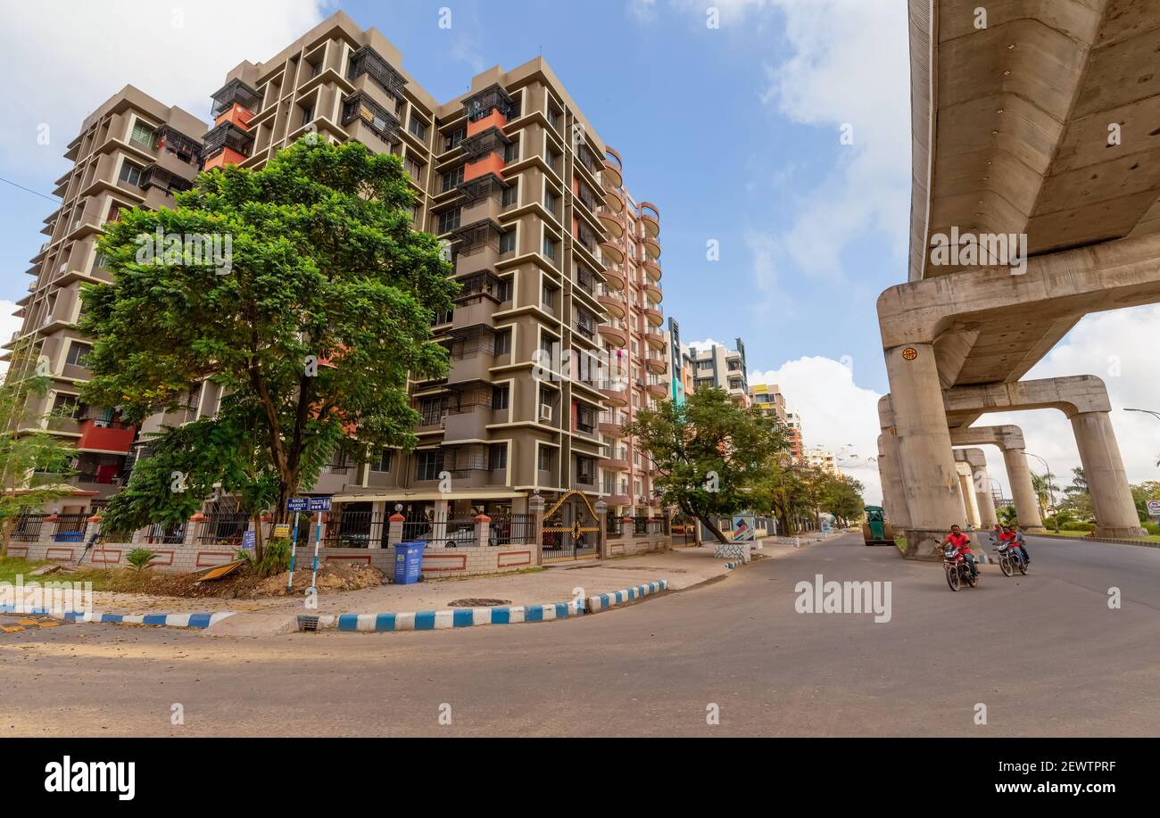 City residential apartment buildings with under construction bridge at ...
