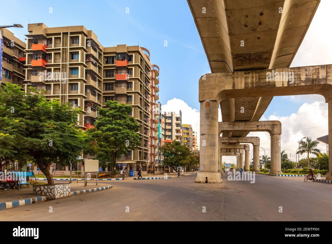 City residential apartment buildings with under construction bridge at ...
