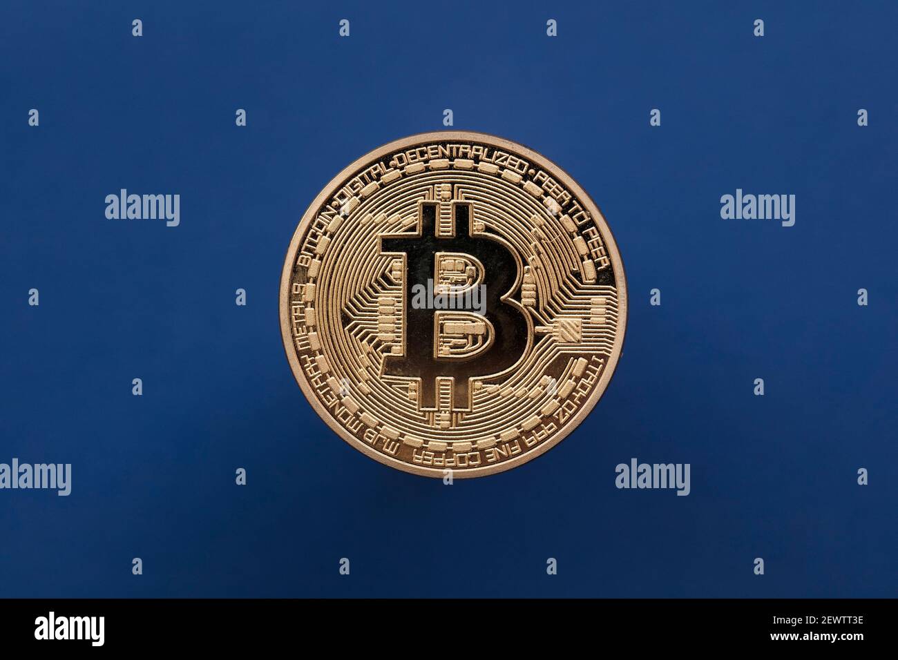 Bitcoin cryptocurrency blockchain gold coin on a blue background Stock ...