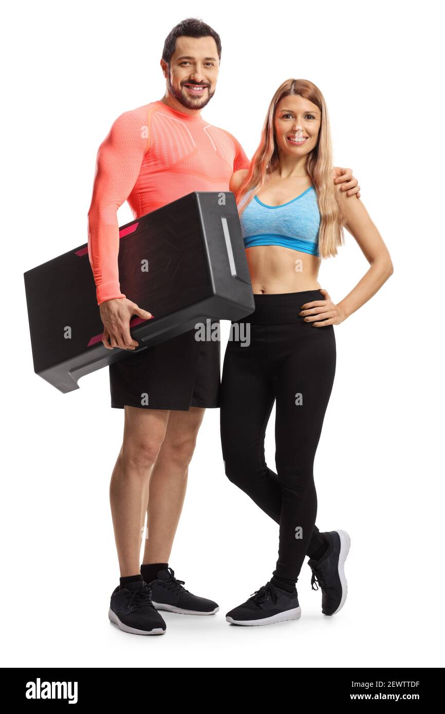 Full length portrait of a man holding a stepper platform and posing ...