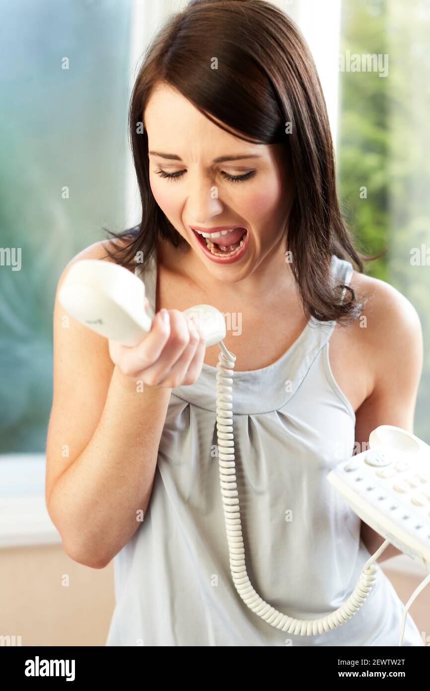 Harassed woman on phone hi-res stock photography and images - Alamy