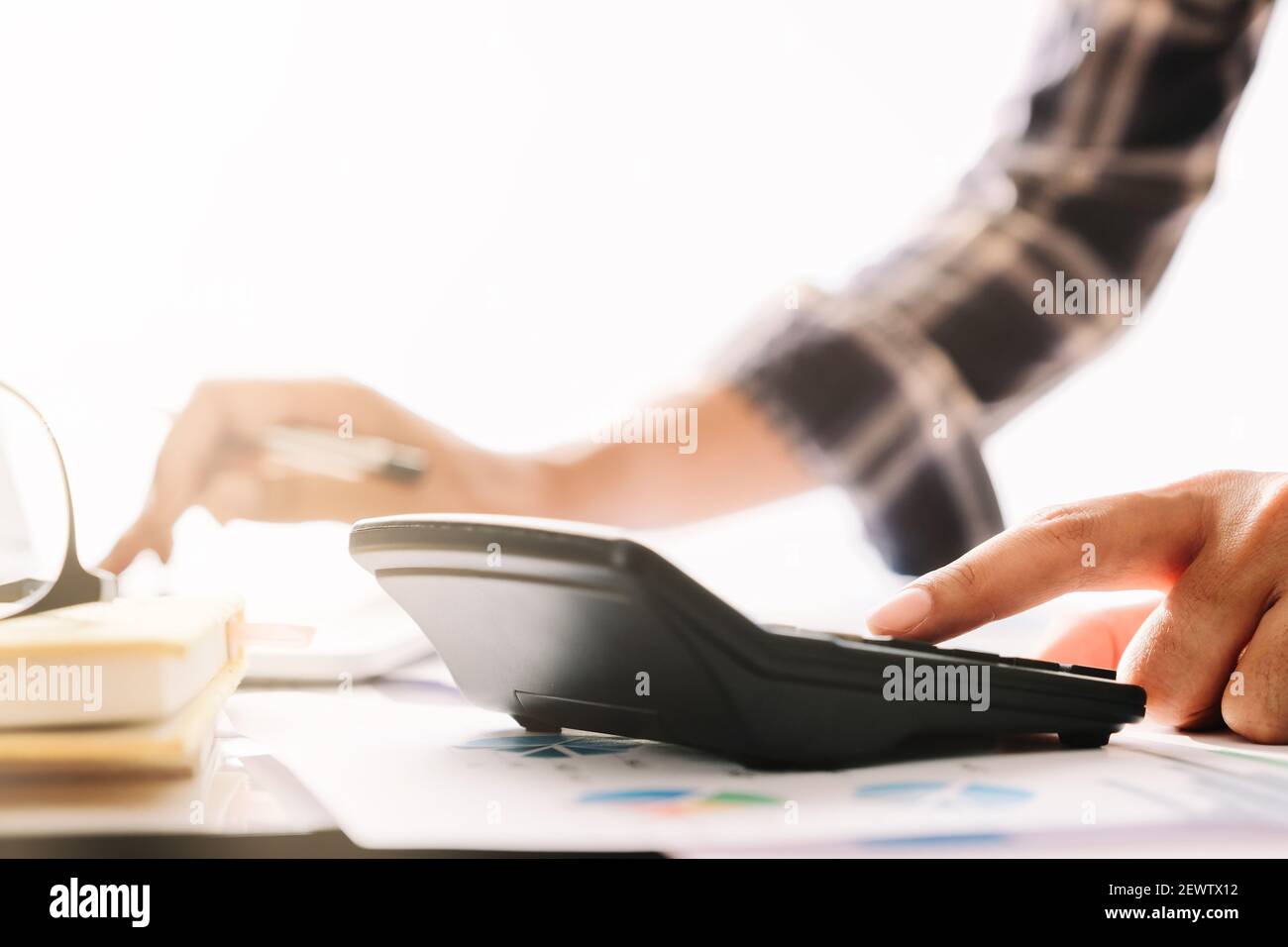 Business man or accountant working with laptop computer for calculating ...