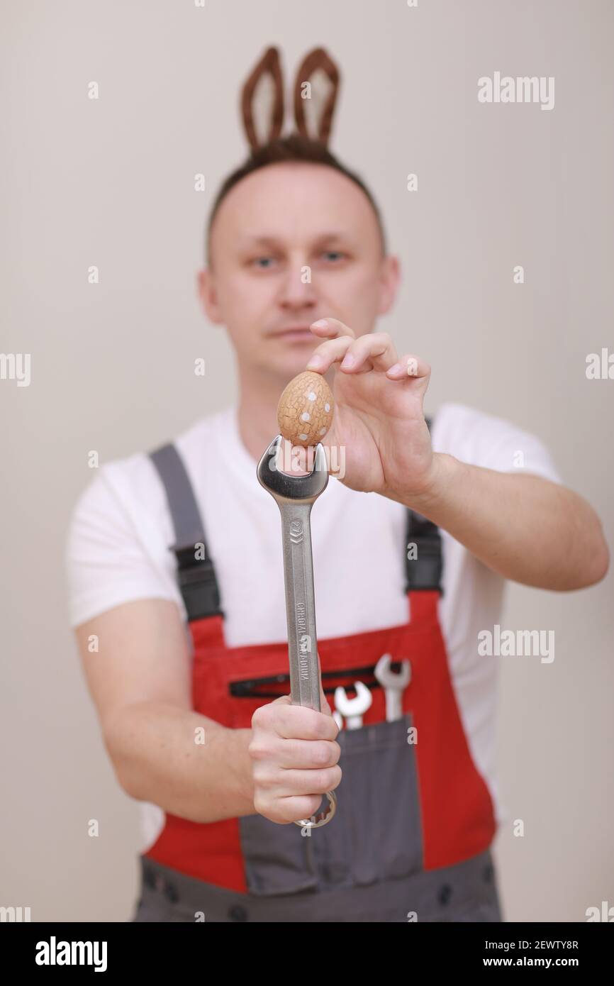 Easter holiday, celebration concept. funny smiling engineer worker or ...