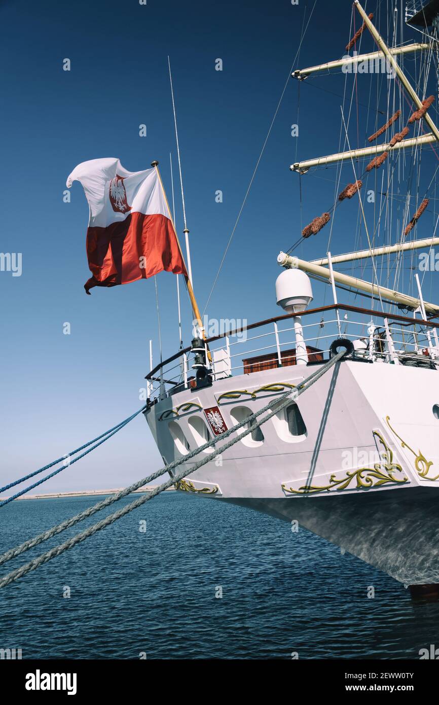 Rear part of old sailing ship moored in port, Polish flag Stock Photo ...