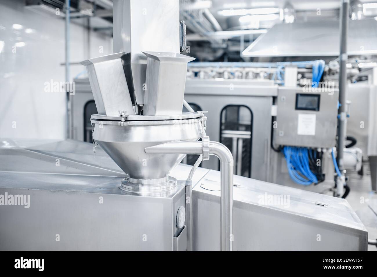 Factory engineer man operating machine control panel in dairy milk ...
