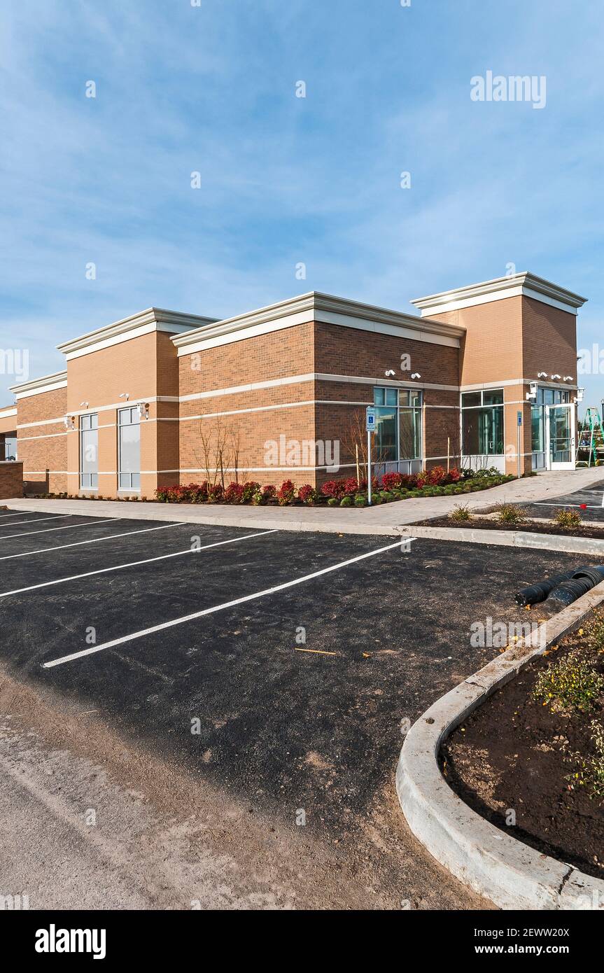 New, modern commercial building under construction showing red brick ...