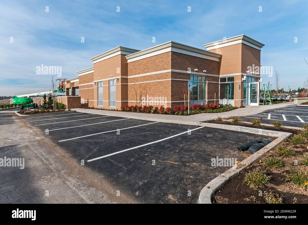 New, modern commercial building under construction showing red brick ...
