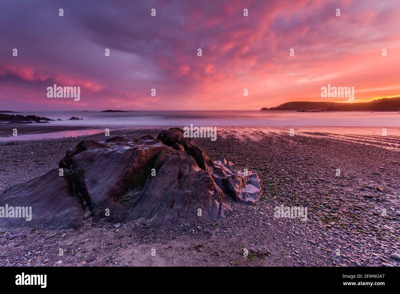 A viivid sunset at Owenahincha beach near the village of Rosscarbery in ...