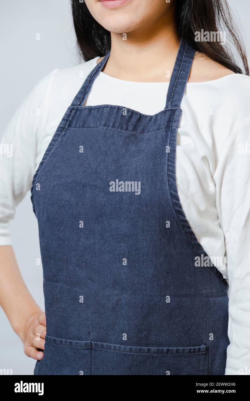 Apron mockup - young woman in blue apron - apron top detail Stock Photo ...
