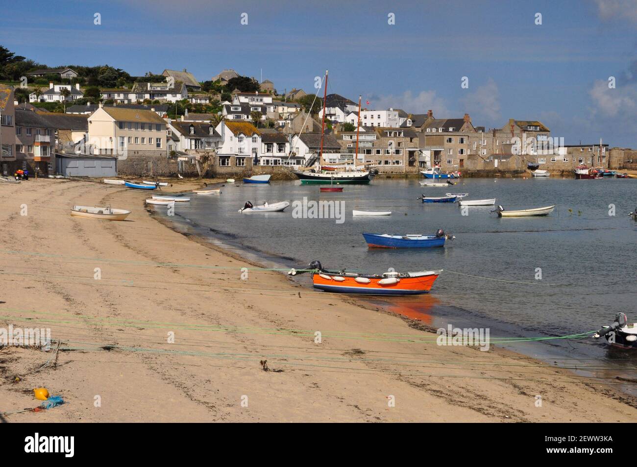 The calm beach and harbour in Hugh Town on the island of St Mary's ...
