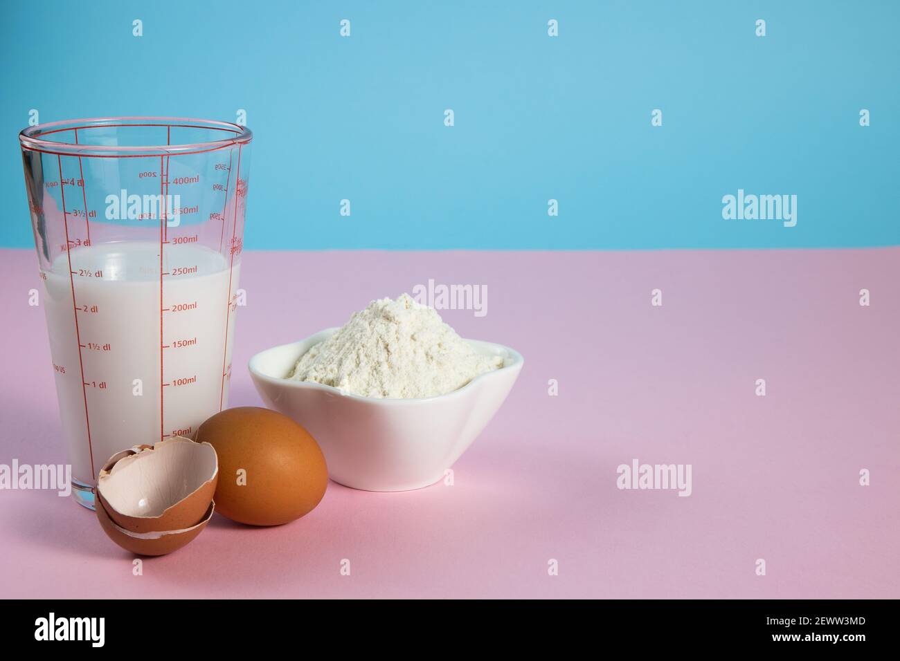eggs milk and flour on pink and light blue background Stock Photo - Alamy