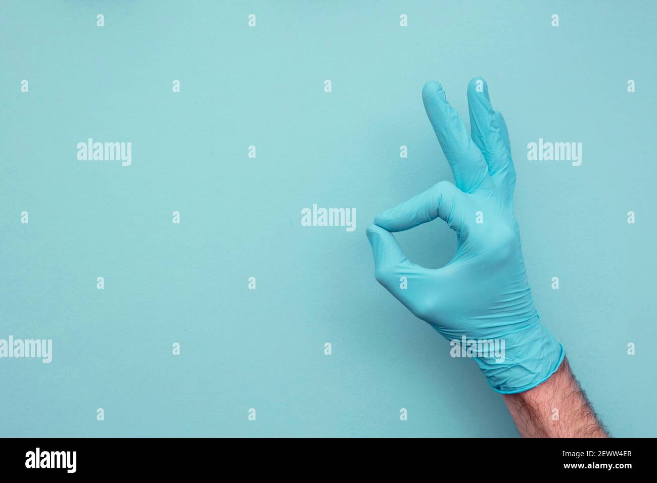 Doctors hand wearing protective surgical gloves giving ok sign Stock ...
