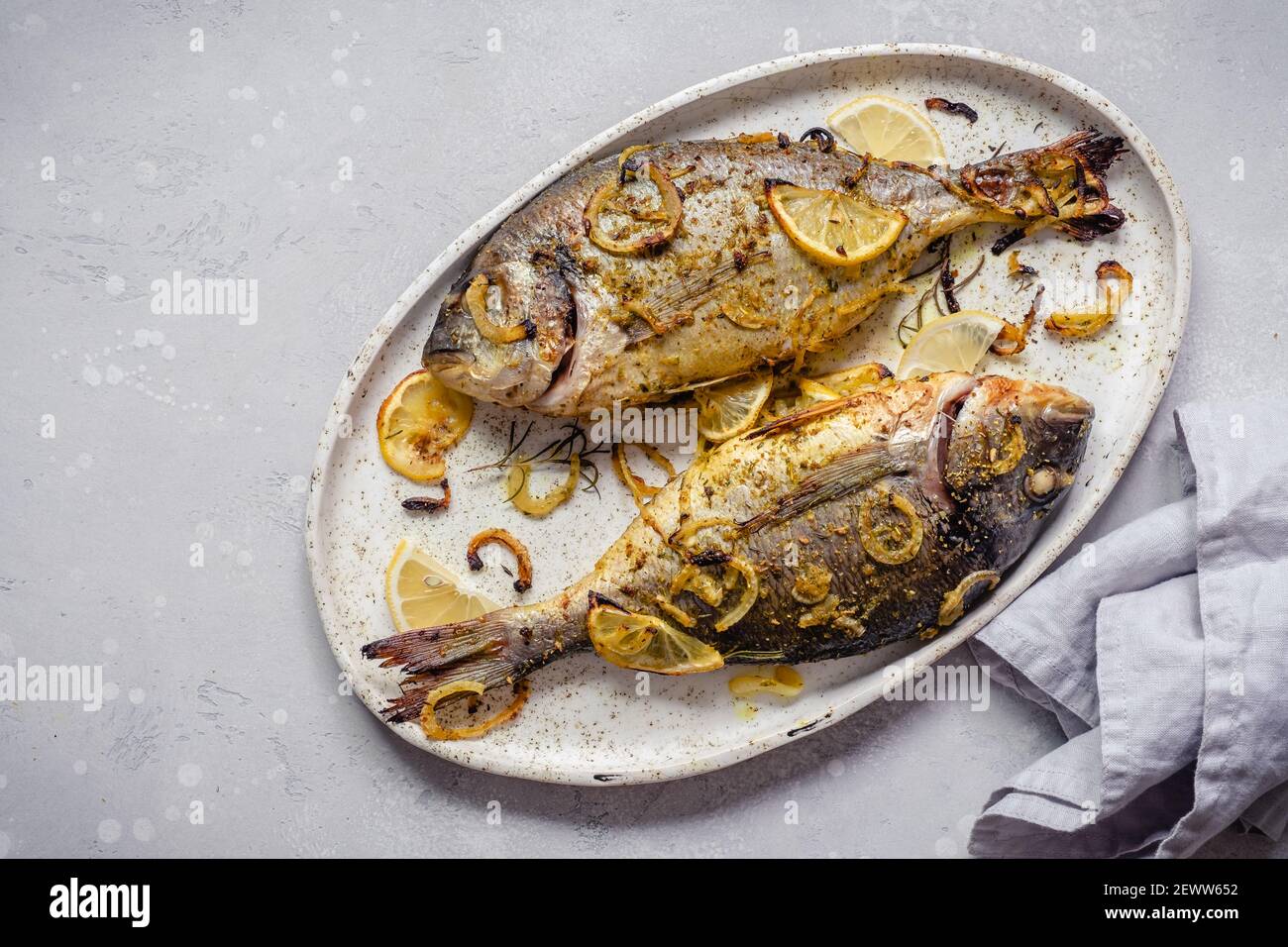 Baked fish dorado. Sea bream or dorada fish grilled Stock Photo - Alamy