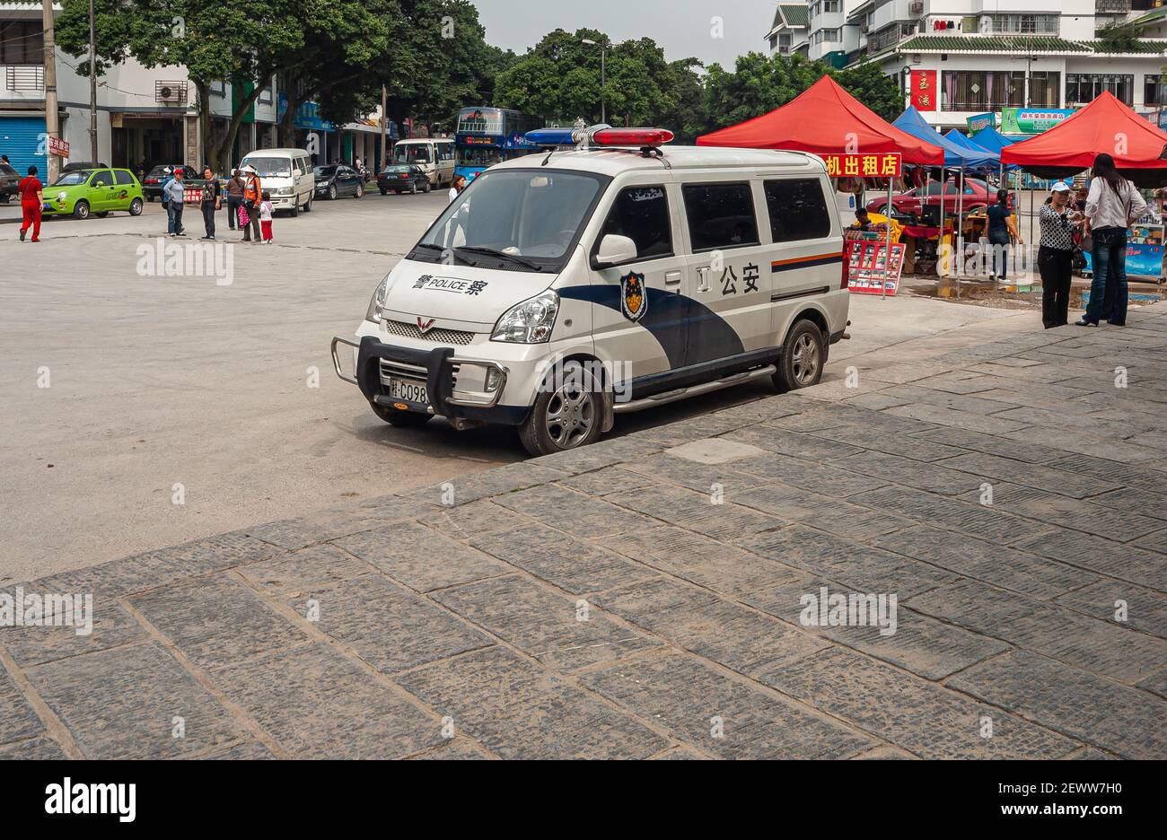 Guilin, China - May 11, 2010: Seven Star Park. White-blue police van ...