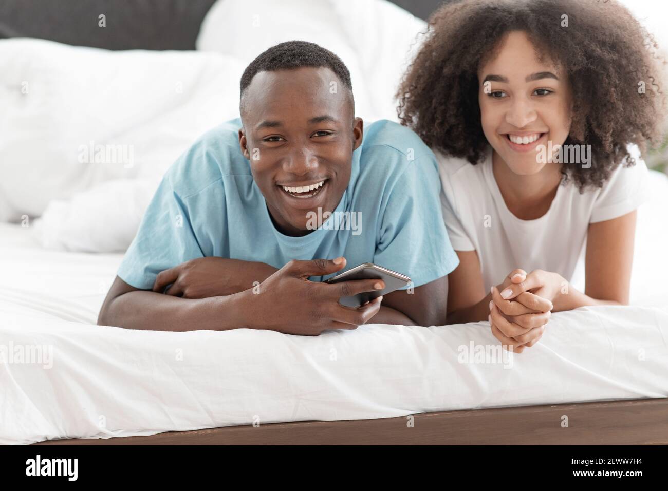 Cheerful romantic couple carefree young husband and wife enjoy weekend ...