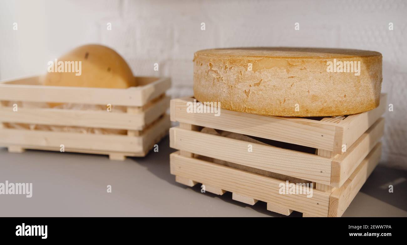 Biological natural round milk cheese in wooden box Stock Photo - Alamy