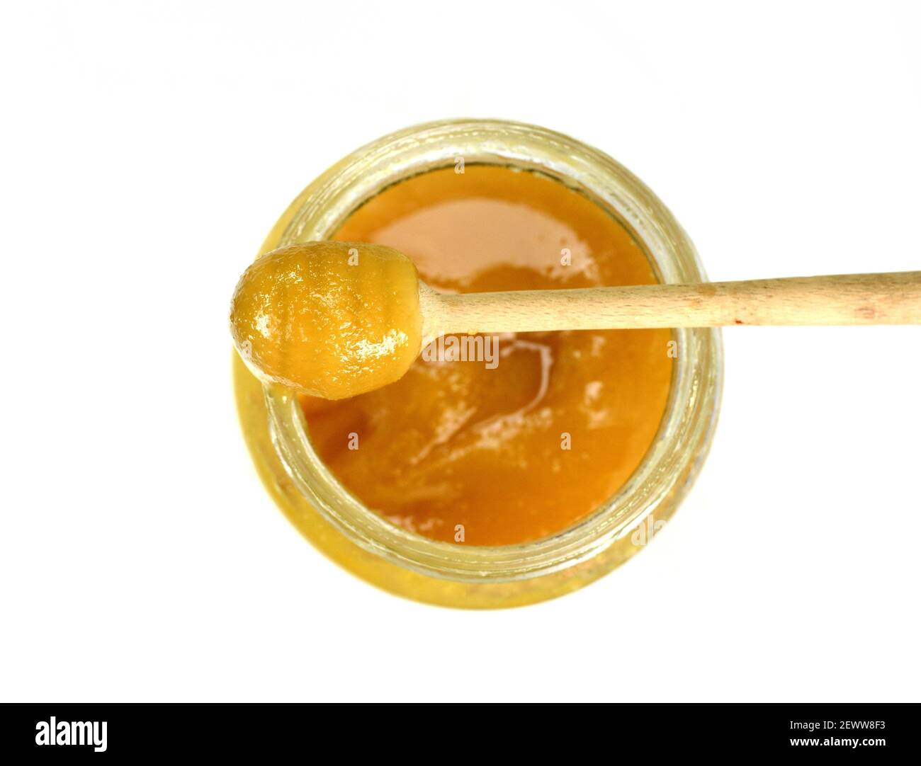 Crystallized honey flow from a dipper, close up Stock Photo - Alamy