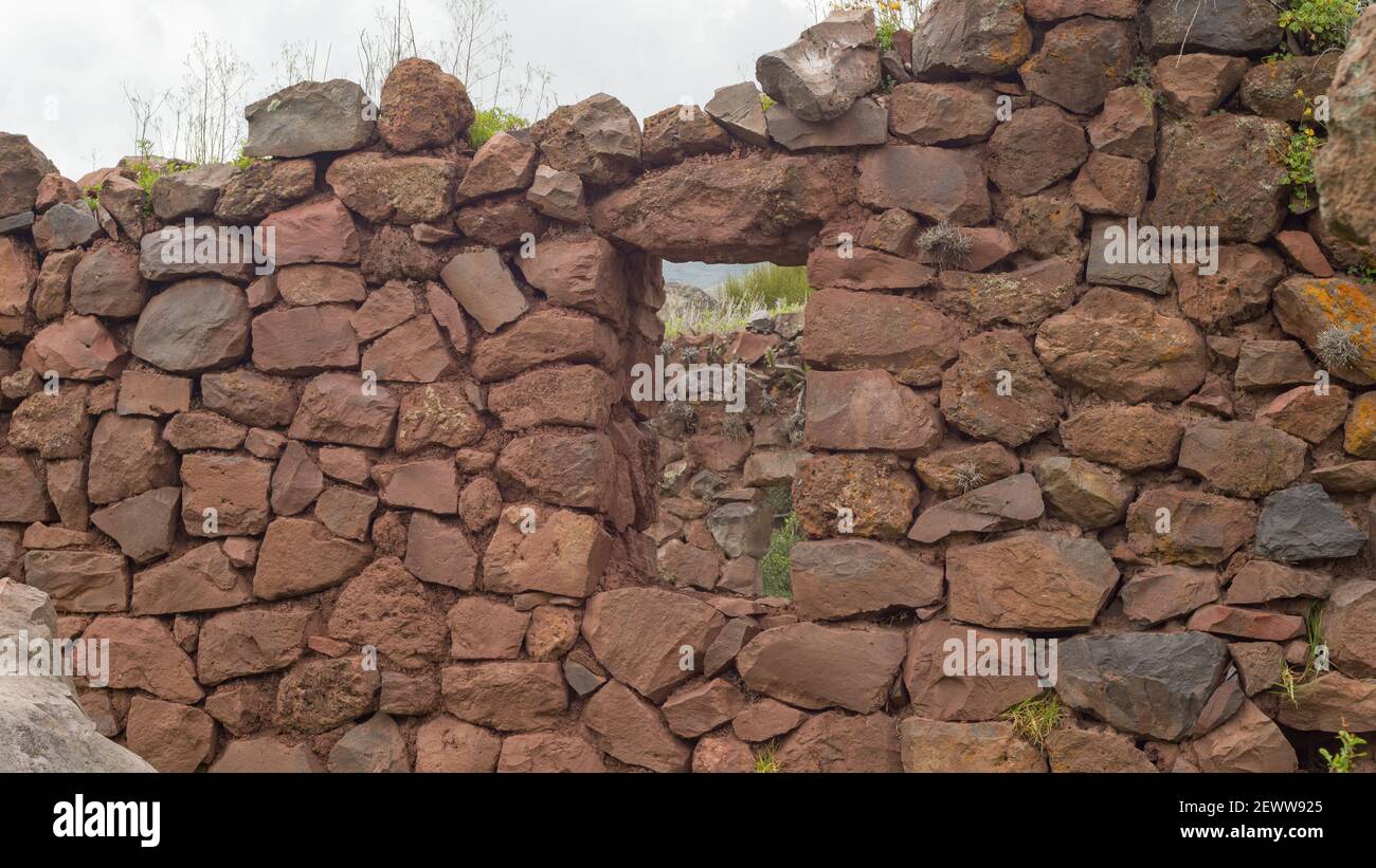 Pikillaqta archaeological site stone wall with window in ruins in Cusco ...