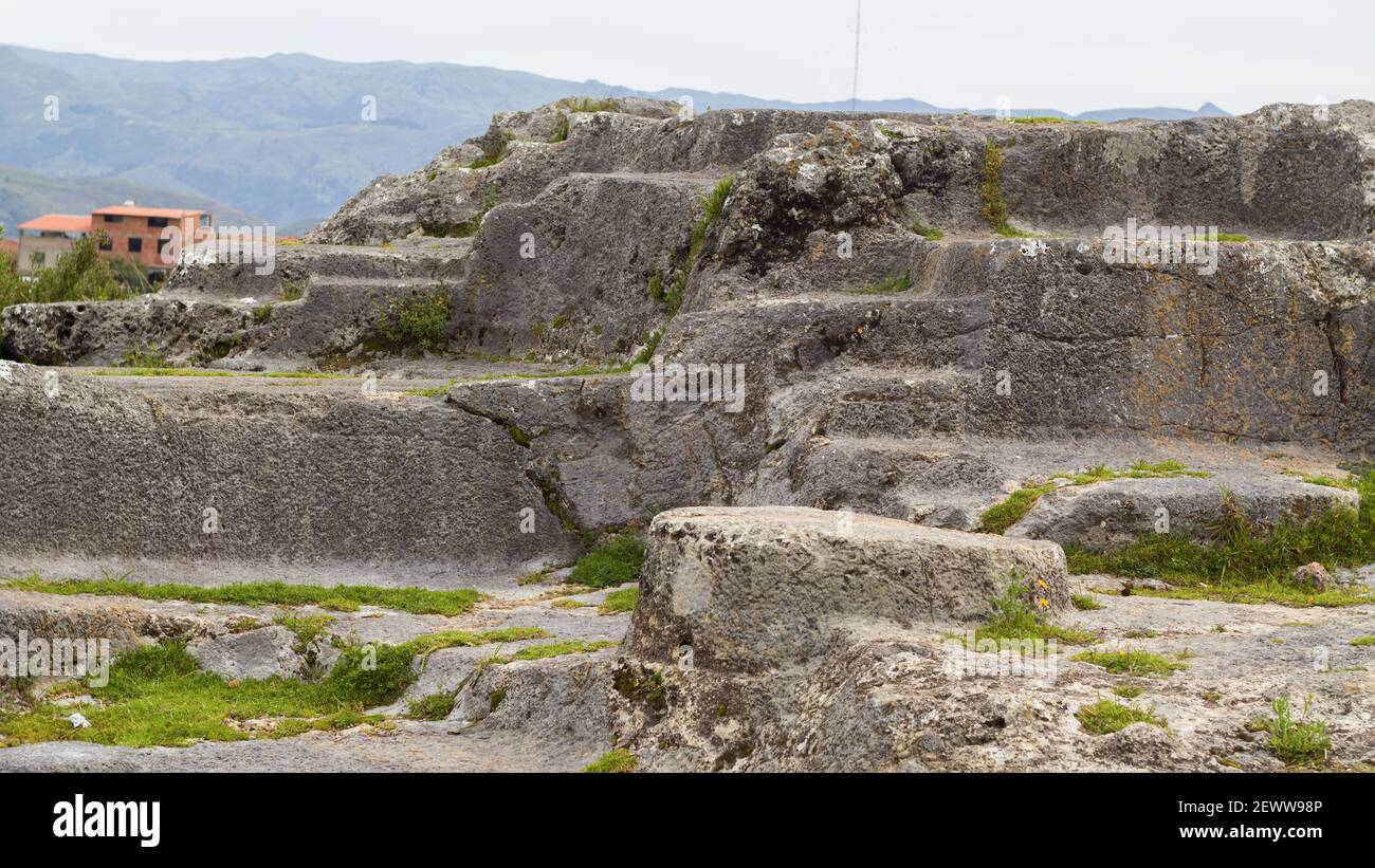 Inca carved stone platforms with grass growing at sacsayhuaman complex ...
