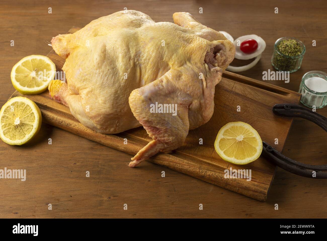 The fresh raw chicken meat on a wooden board with ingredients Stock ...